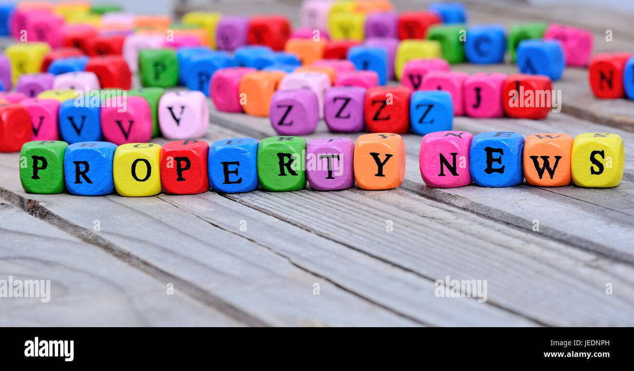 Property news words on wooden table Stock Photo - Alamy