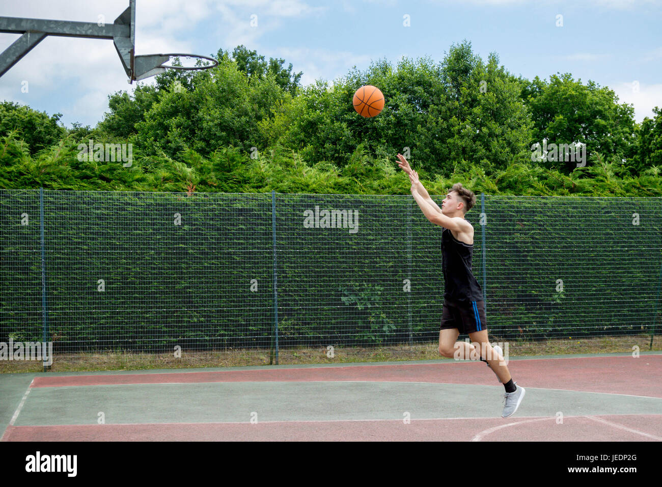 Male Teen Shooting Basketball High Resolution Stock Photography and ...