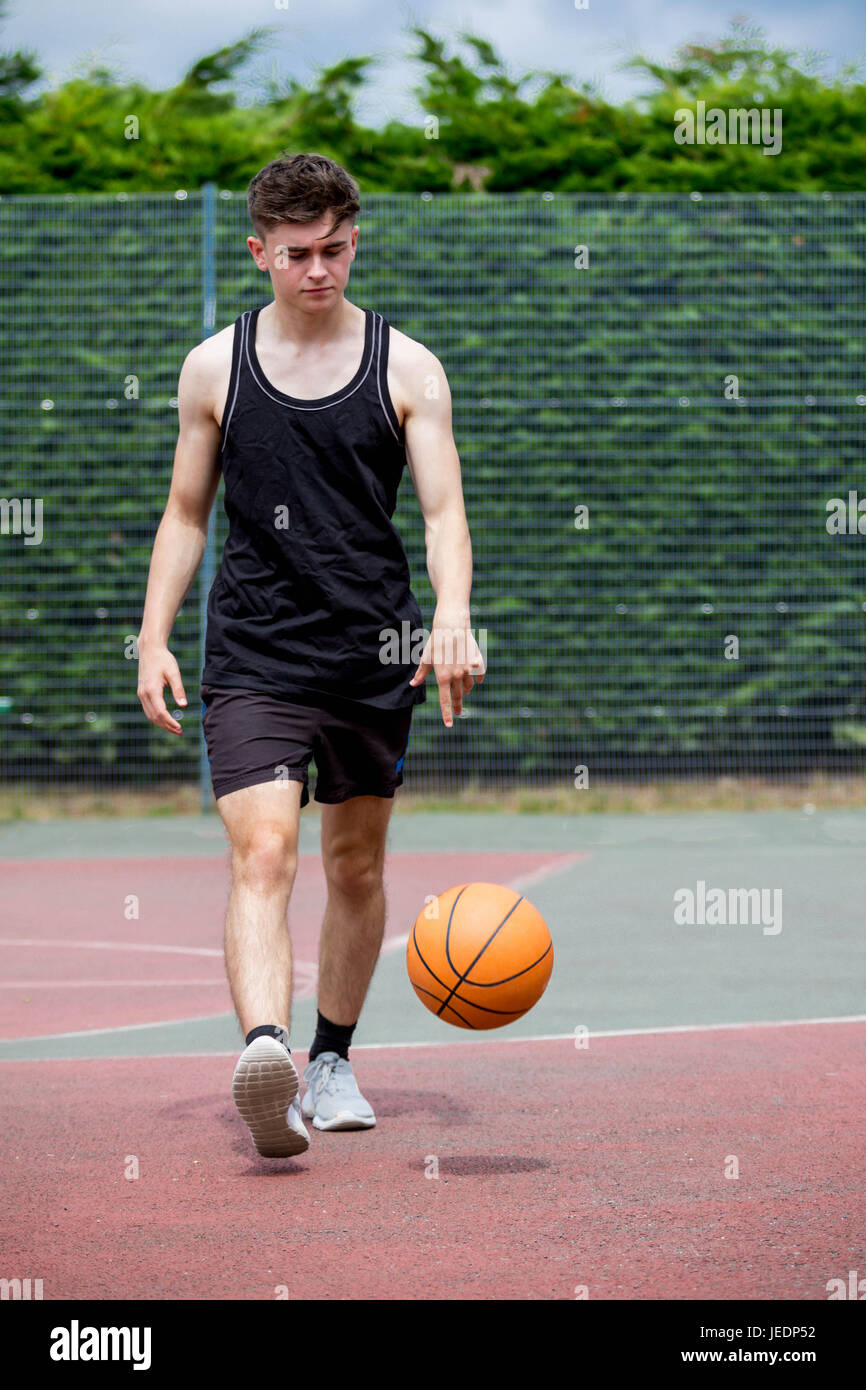 Boy bouncing ball hi-res stock photography and images - Alamy