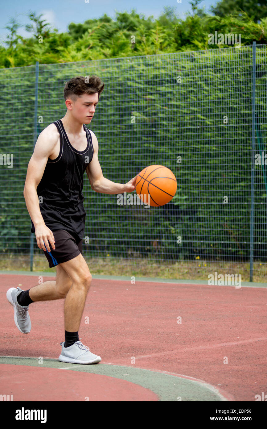 Boy bouncing ball hi-res stock photography and images - Alamy