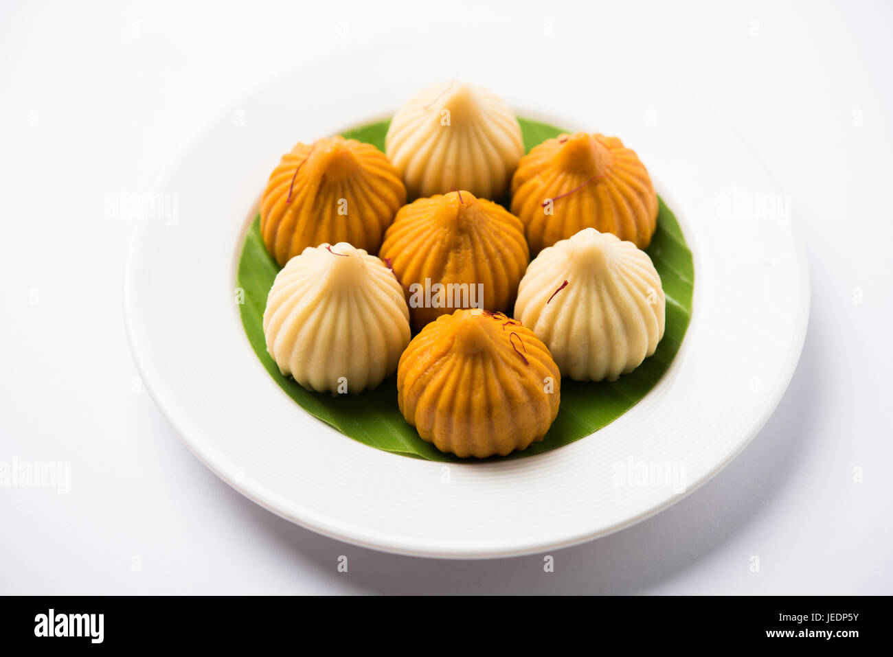 A modak is an Indian sweet dumpling popular in India. It is called ...