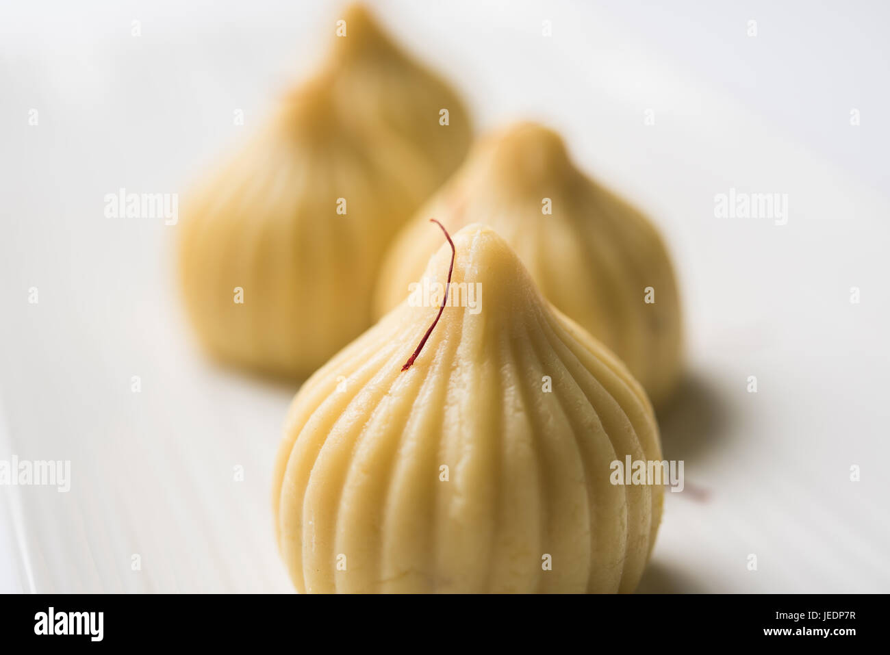 A modak is an Indian sweet dumpling popular in India. It is called ...