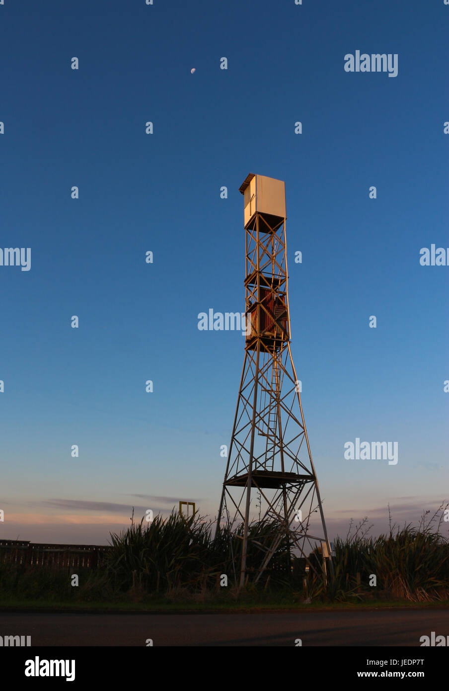 Lookout Tower with the moon too Stock Photo - Alamy