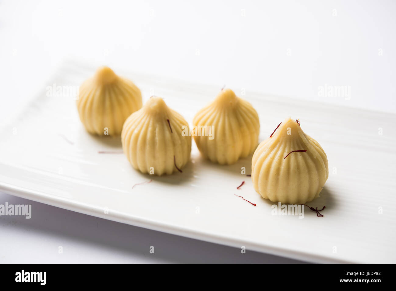 A modak is an Indian sweet dumpling popular in India. It is called ...