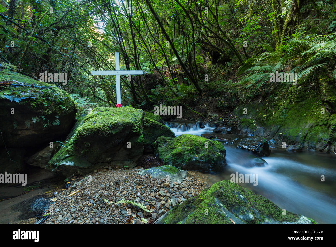 White cross in some stream rocks Stock Photo - Alamy