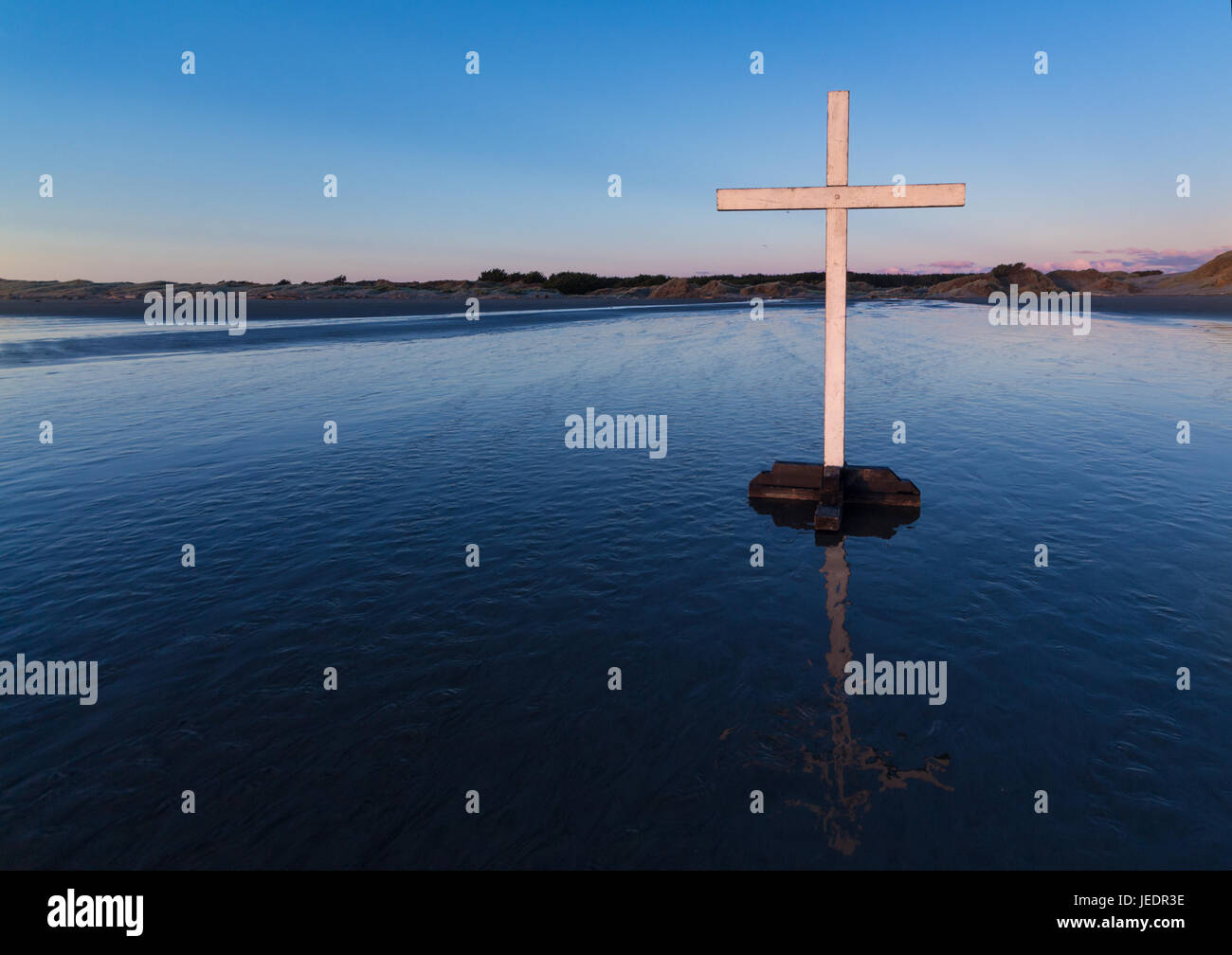 White cross on water with a bit of reflection Stock Photo - Alamy
