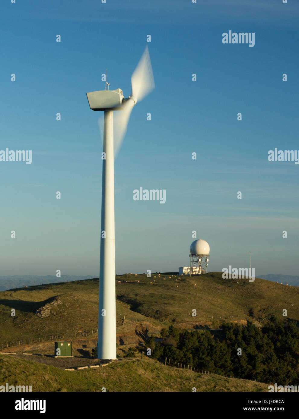 Wind turbine inmotion with a radar in the background Stock Photo - Alamy
