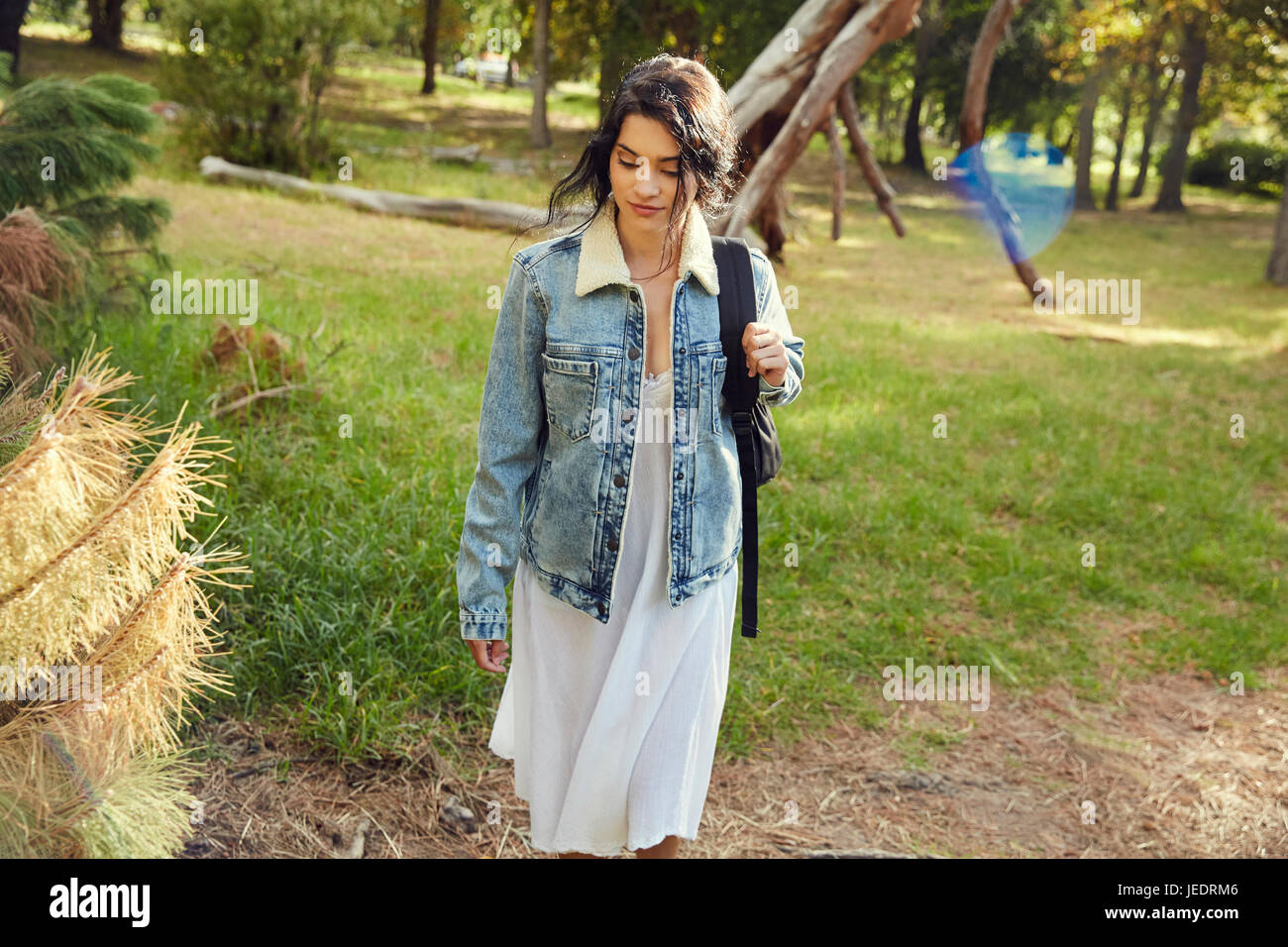 Young woman walking in nature Stock Photo - Alamy