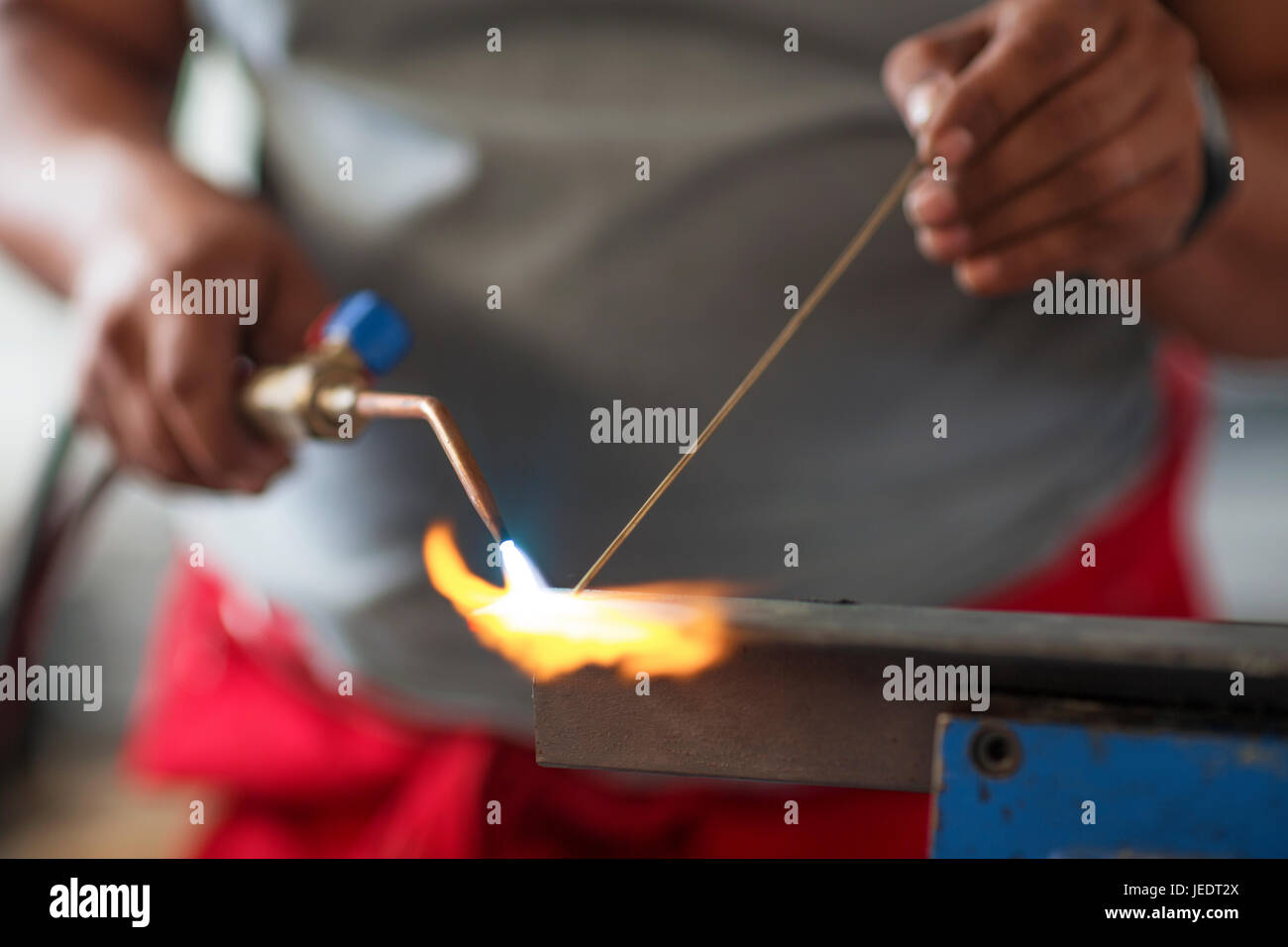 Mechanic welding in car workshop Stock Photo - Alamy