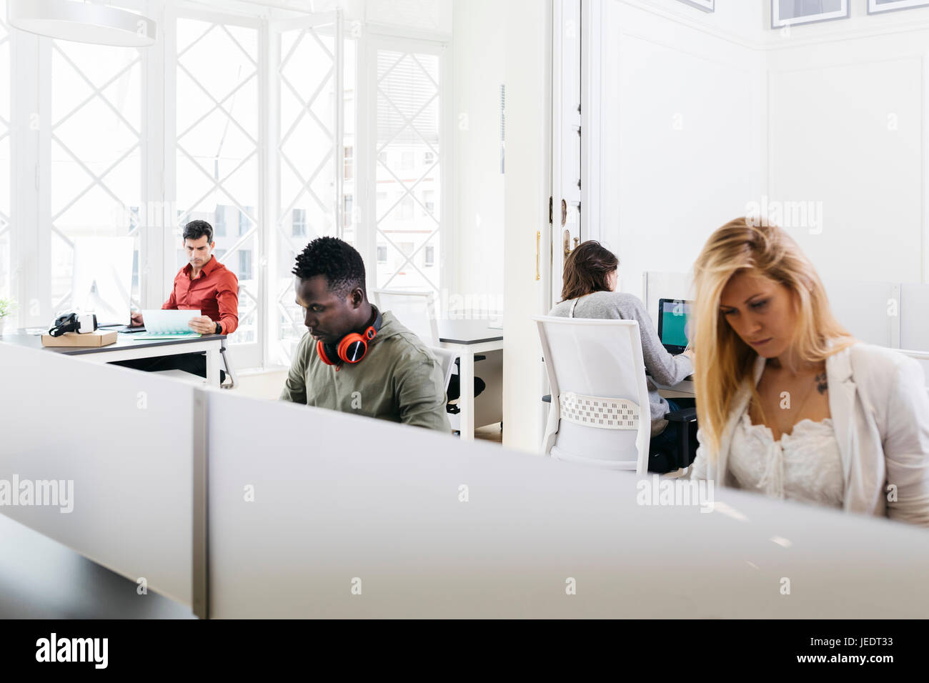 Business people working together in international office Stock Photo ...