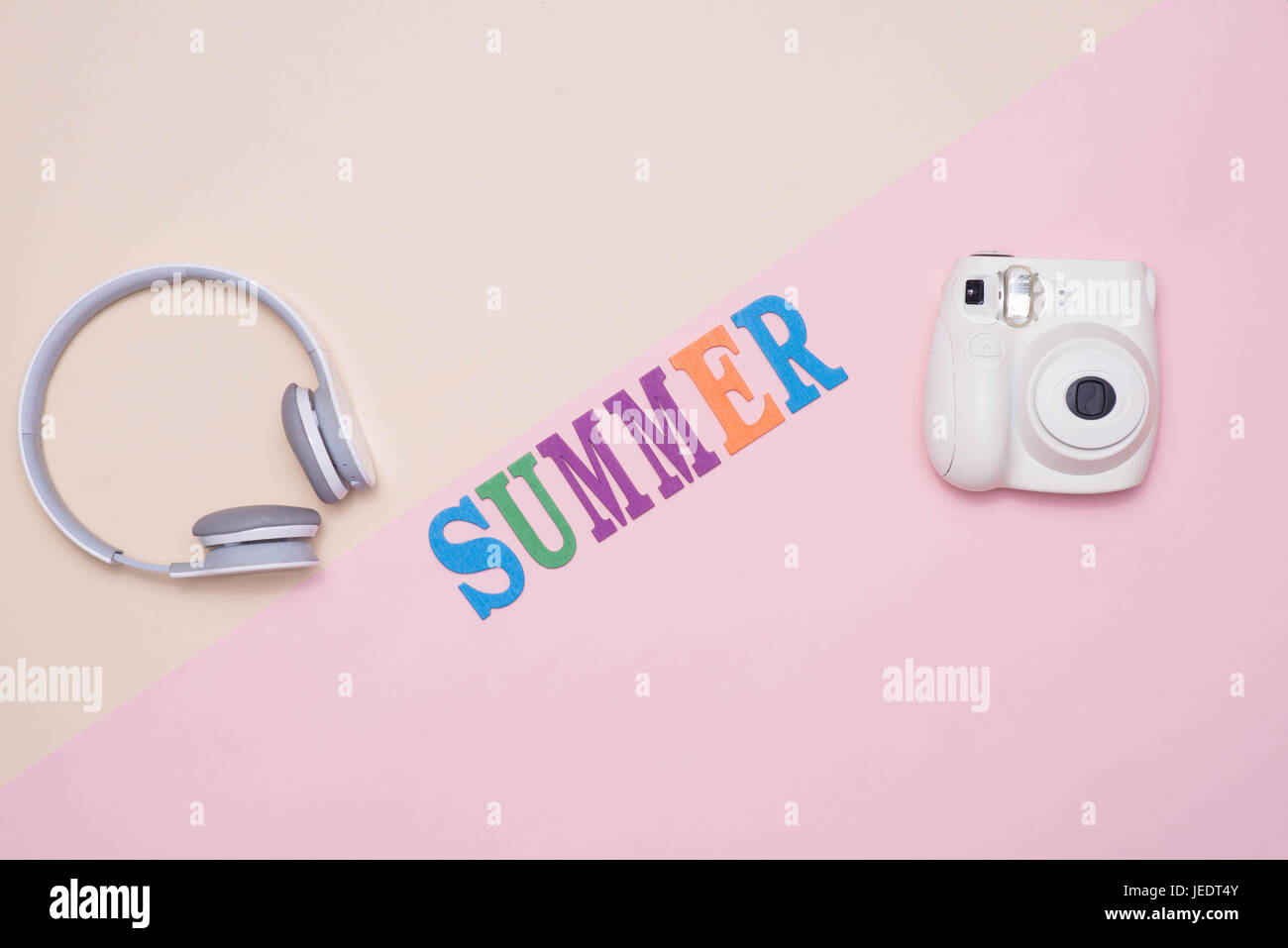 Summer fun written in colorful wooden letters on pastel color ...