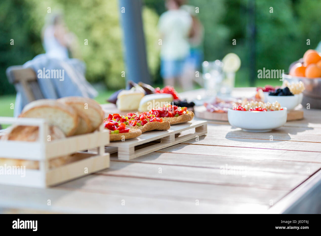 Light summer snacks on a table Stock Photo - Alamy