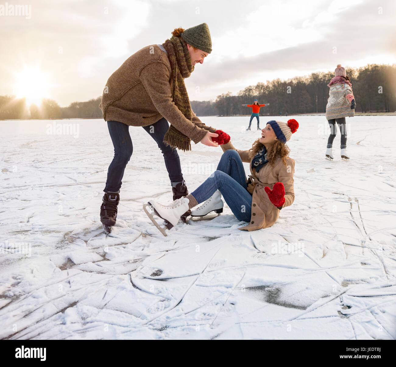Couple falling ice skating hi-res stock photography and images - Alamy