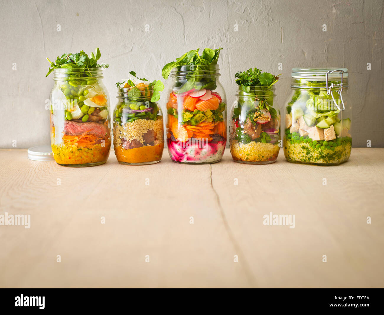 Row of five preserving jars with various salads Stock Photo - Alamy