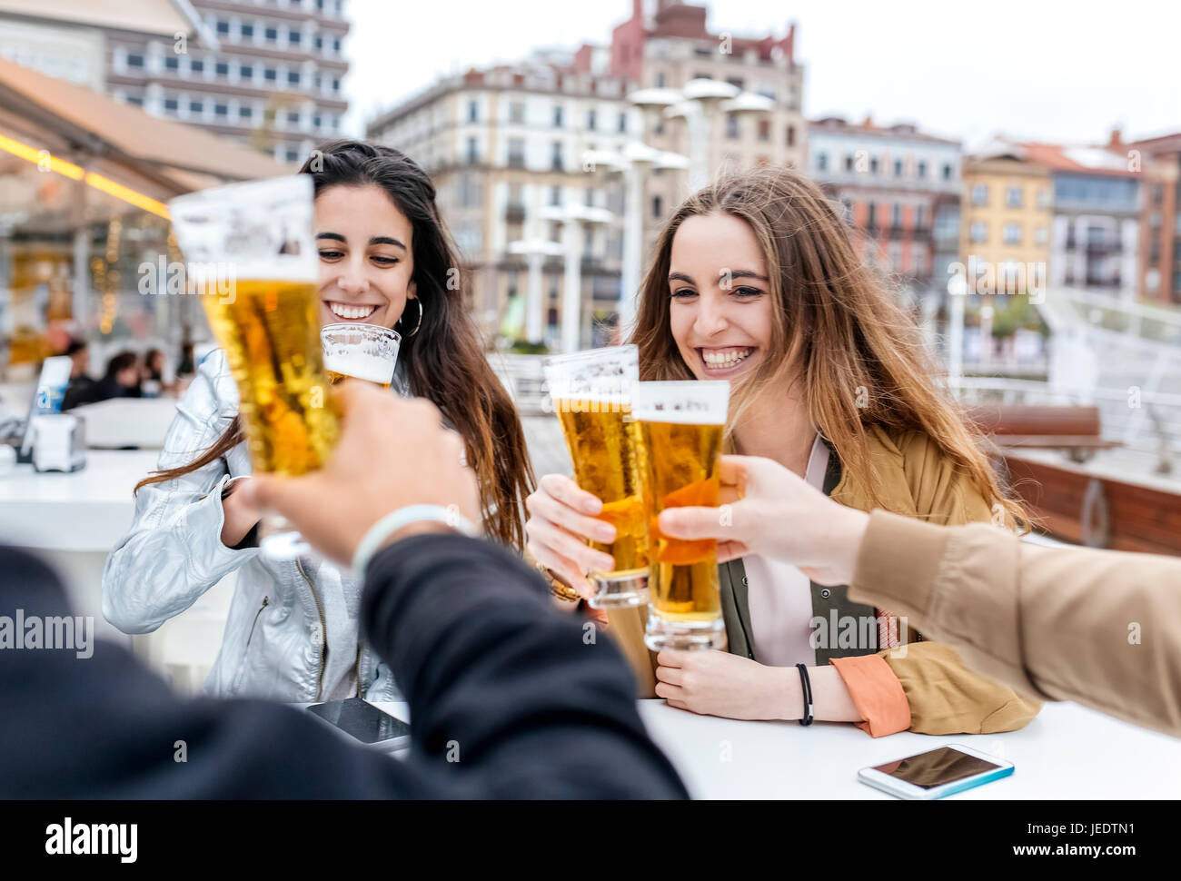 Group of friends toasting with beer Stock Photo - Alamy