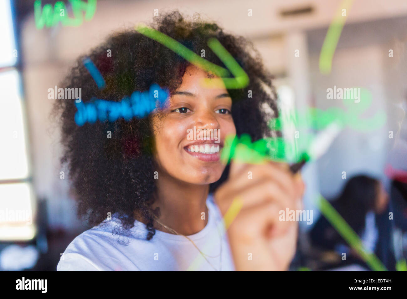 Businesswoman writing on glass wall Stock Photo - Alamy Businesswoman writing on glass wall Stock Photo - Alamy