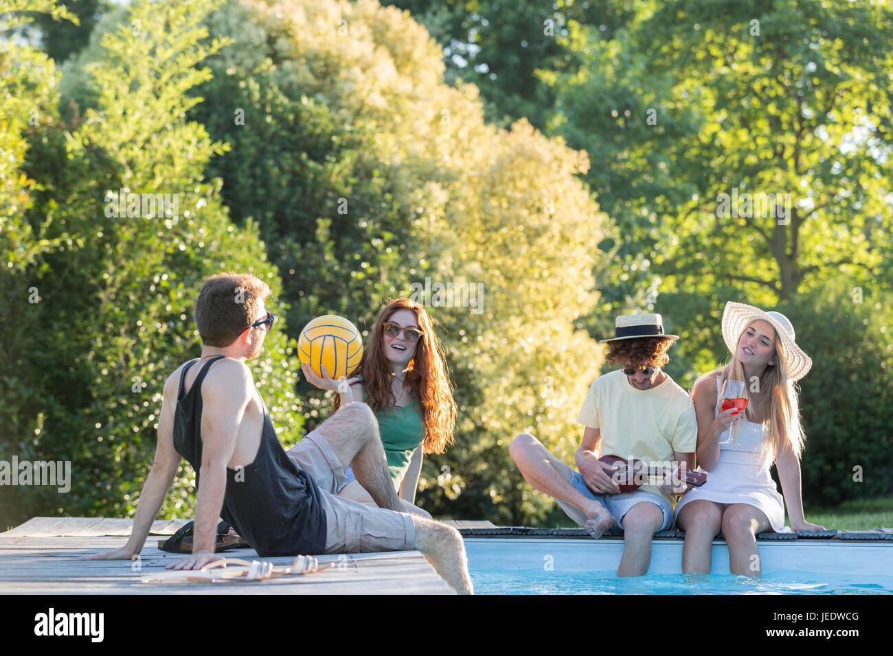 Four friends relaxing pool hi-res stock photography and images - Alamy