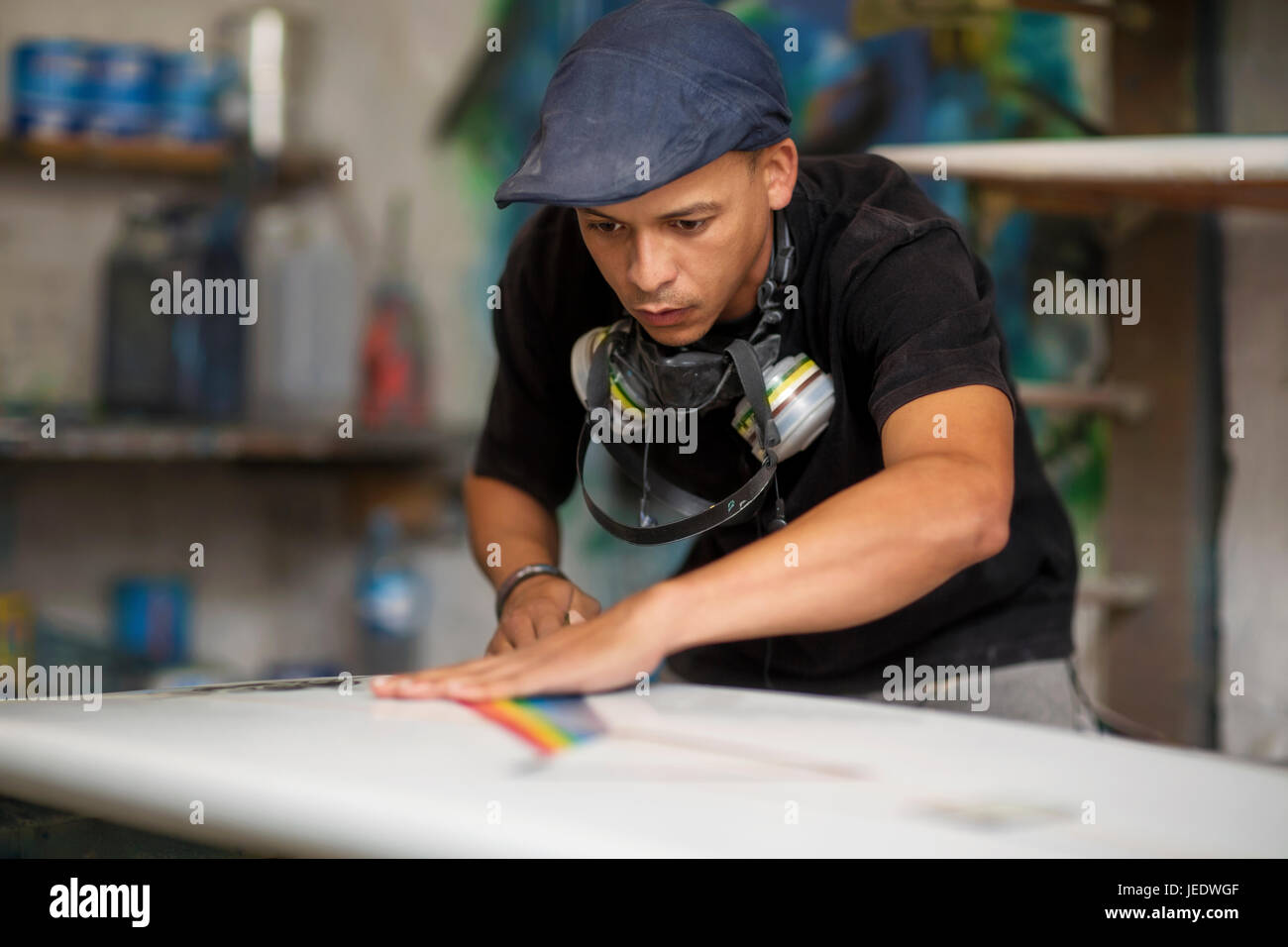 Surfboard shaper workshop, surfshop employee working on surfboard Stock ...