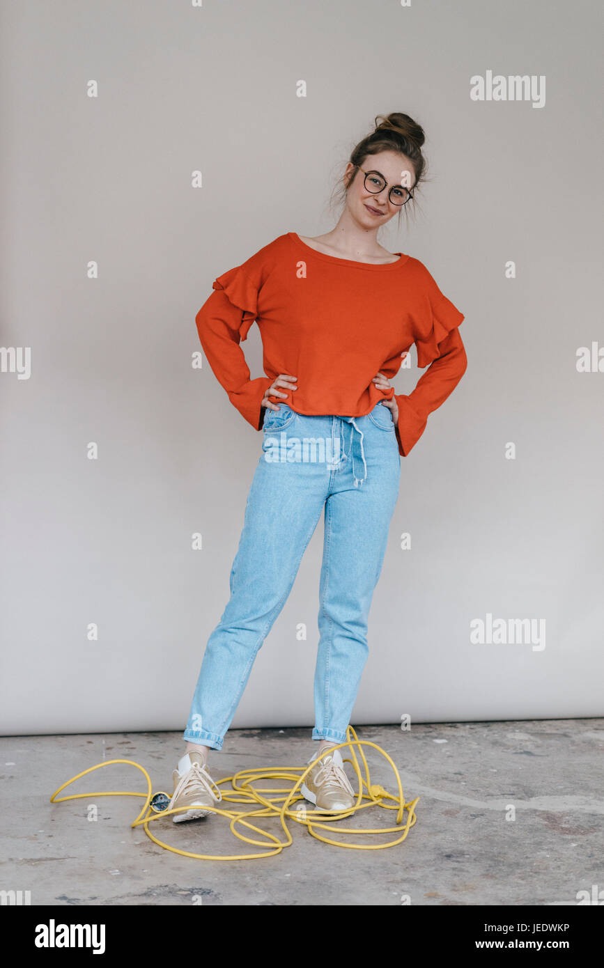 Portrait of young woman and tangled cable Stock Photo - Alamy