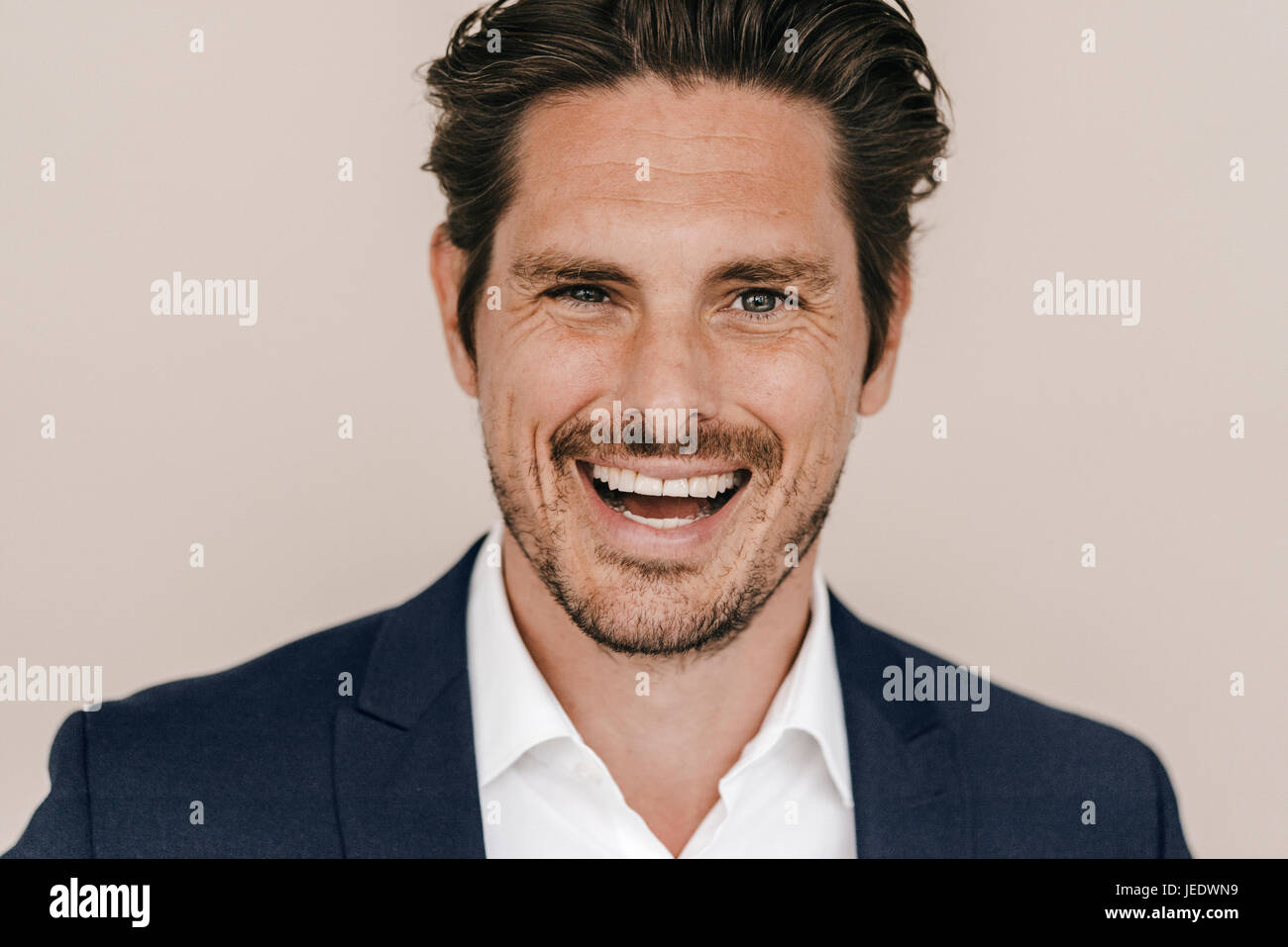 Portrait of laughing businessman Stock Photo - Alamy