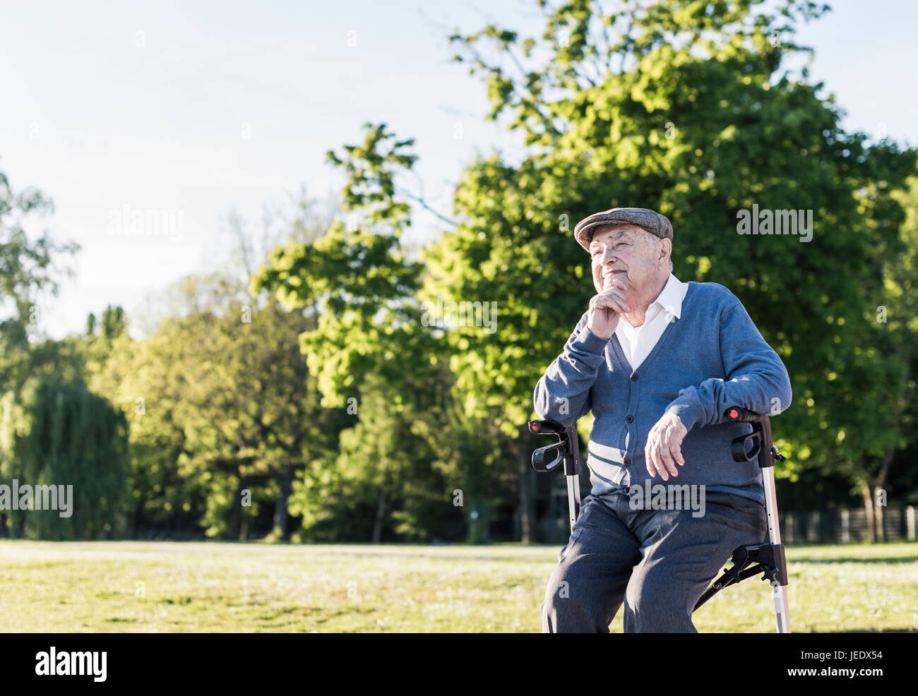 Old man sitting on walker hi-res stock photography and images - Alamy