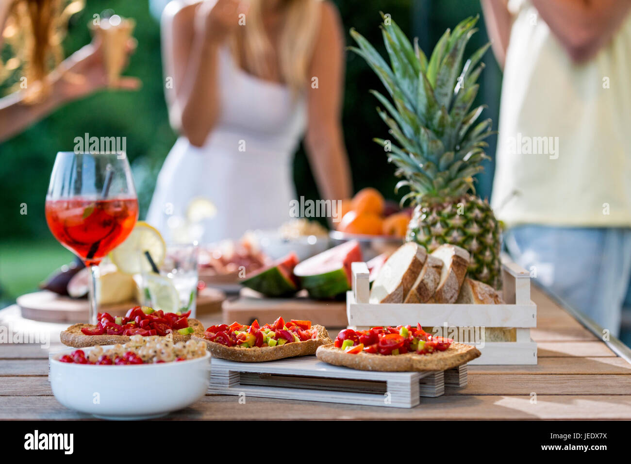 Friends eating light summer snacks in the afternoon Stock Photo - Alamy