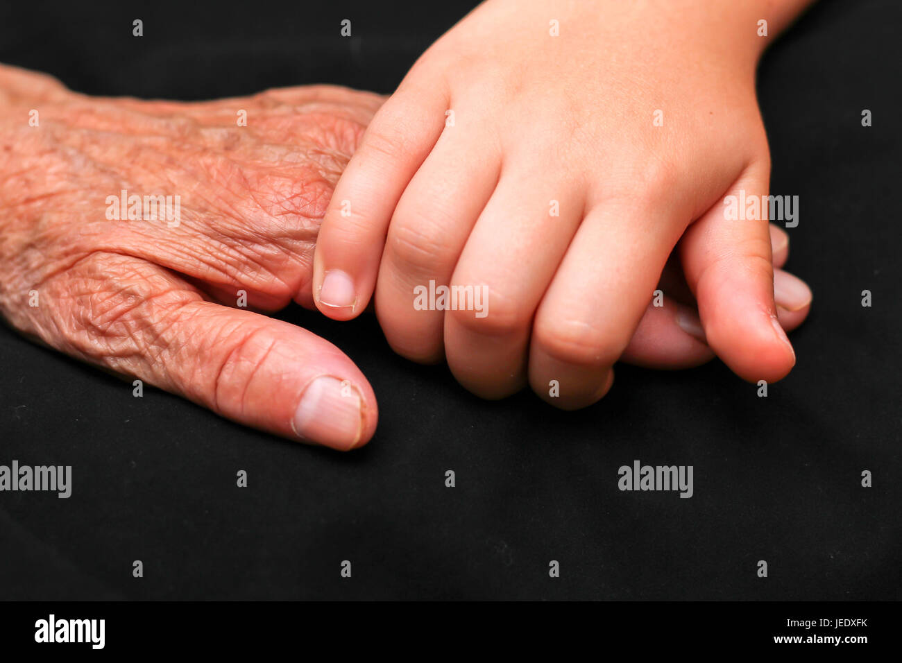 Old young hands touching hi-res stock photography and images - Alamy