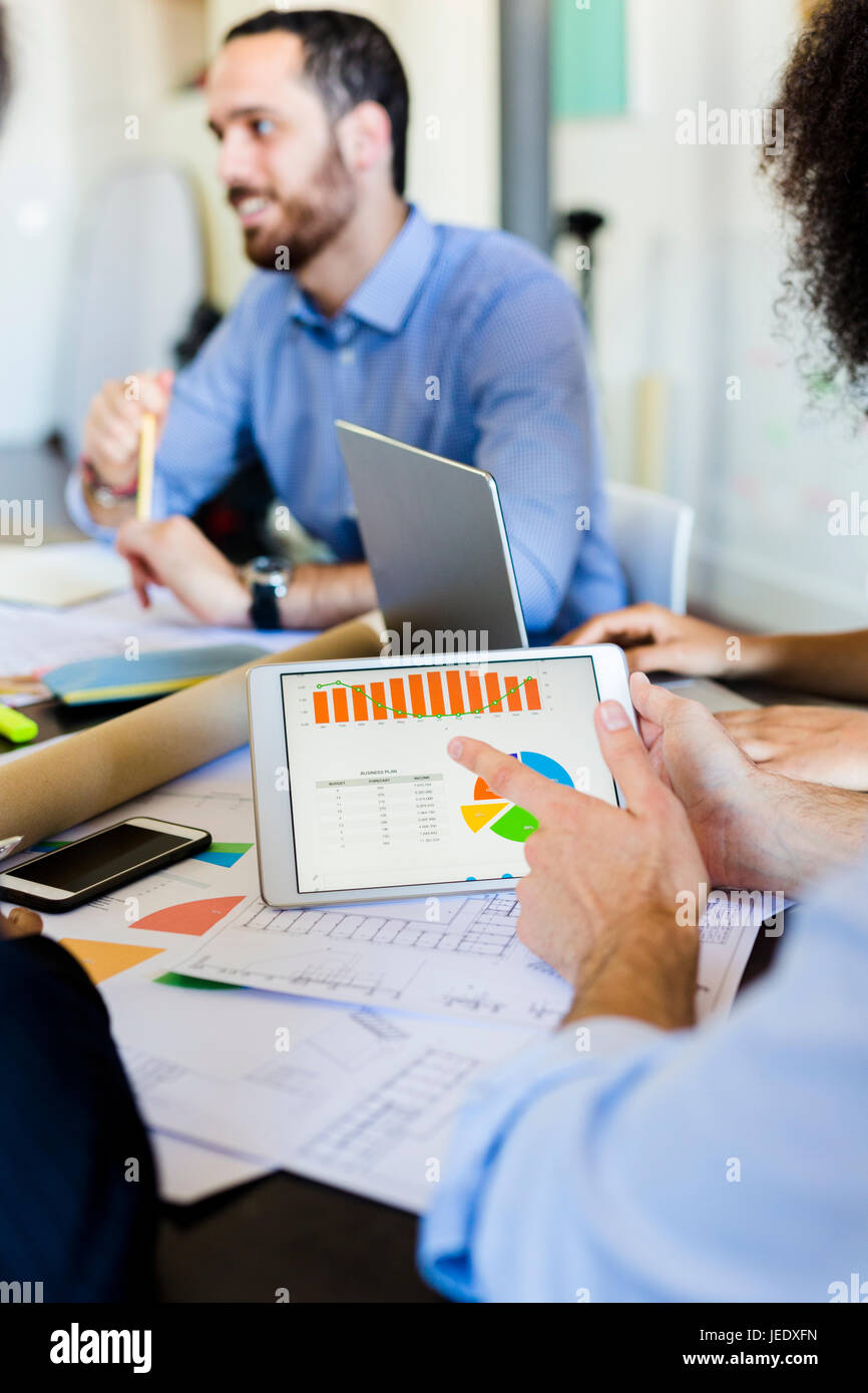 Business people analyzing data in office Stock Photo - Alamy