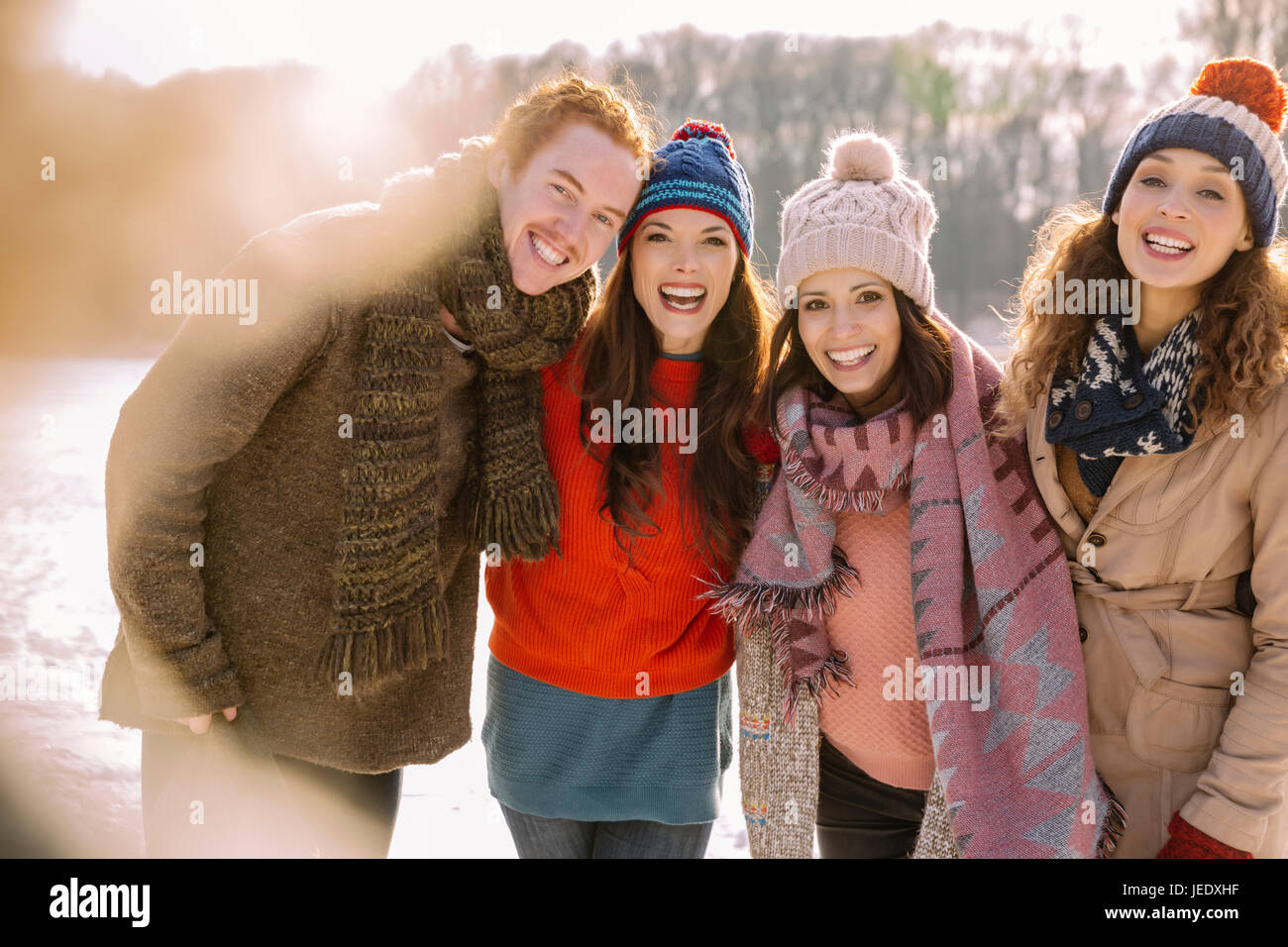 Portrait of happy friends outdoors in winter Stock Photo - Alamy