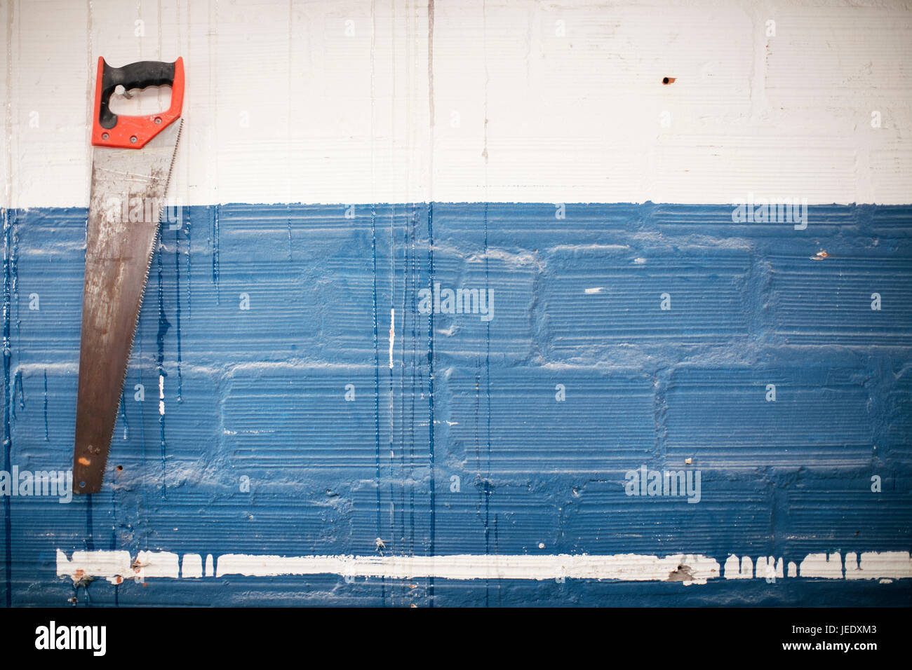 Saw hanging on wall Stock Photo - Alamy