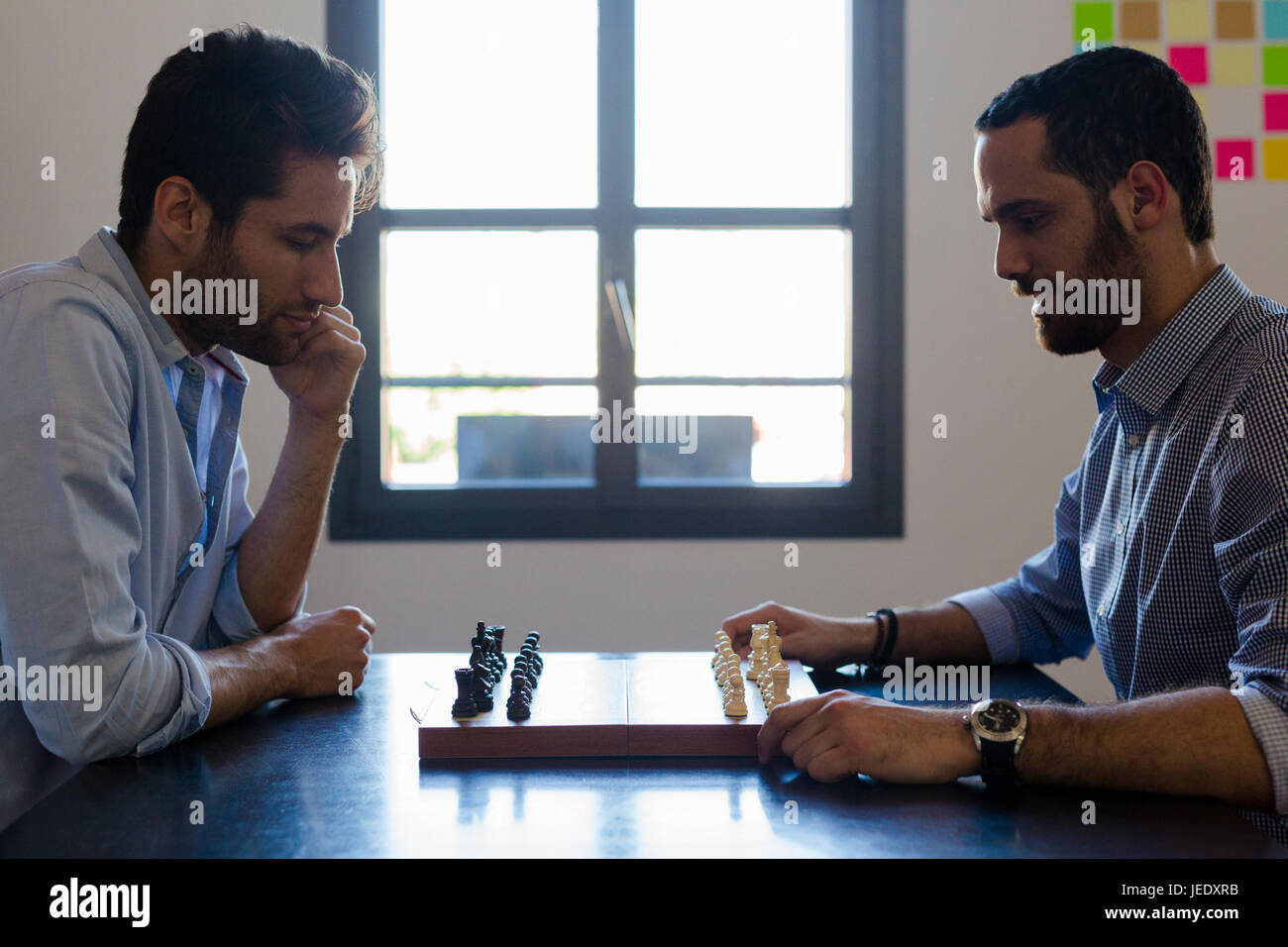 Two men playing chess Stock Photo - Alamy