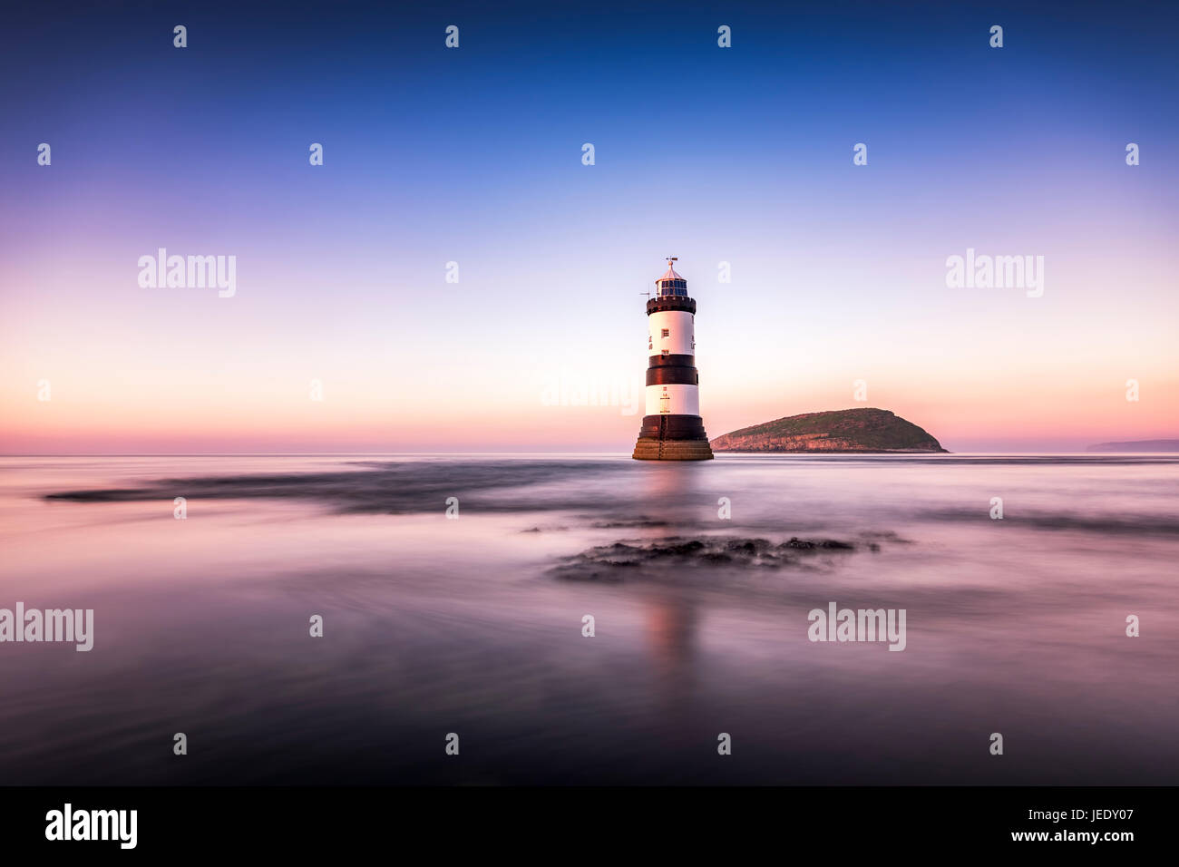 Trywn Du Lighthouse (Penmon Lighthouse), with Puffin Island in the ...