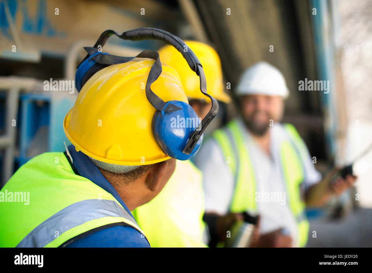 Quarry workers wearing protective clothing Stock Photo - Alamy