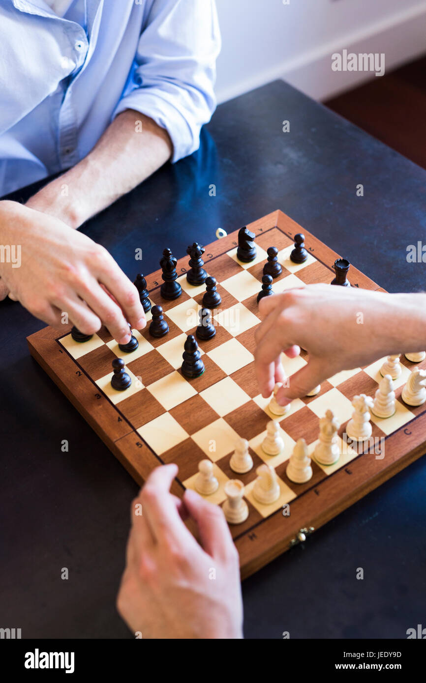 Hand placing chess piece hi-res stock photography and images - Alamy