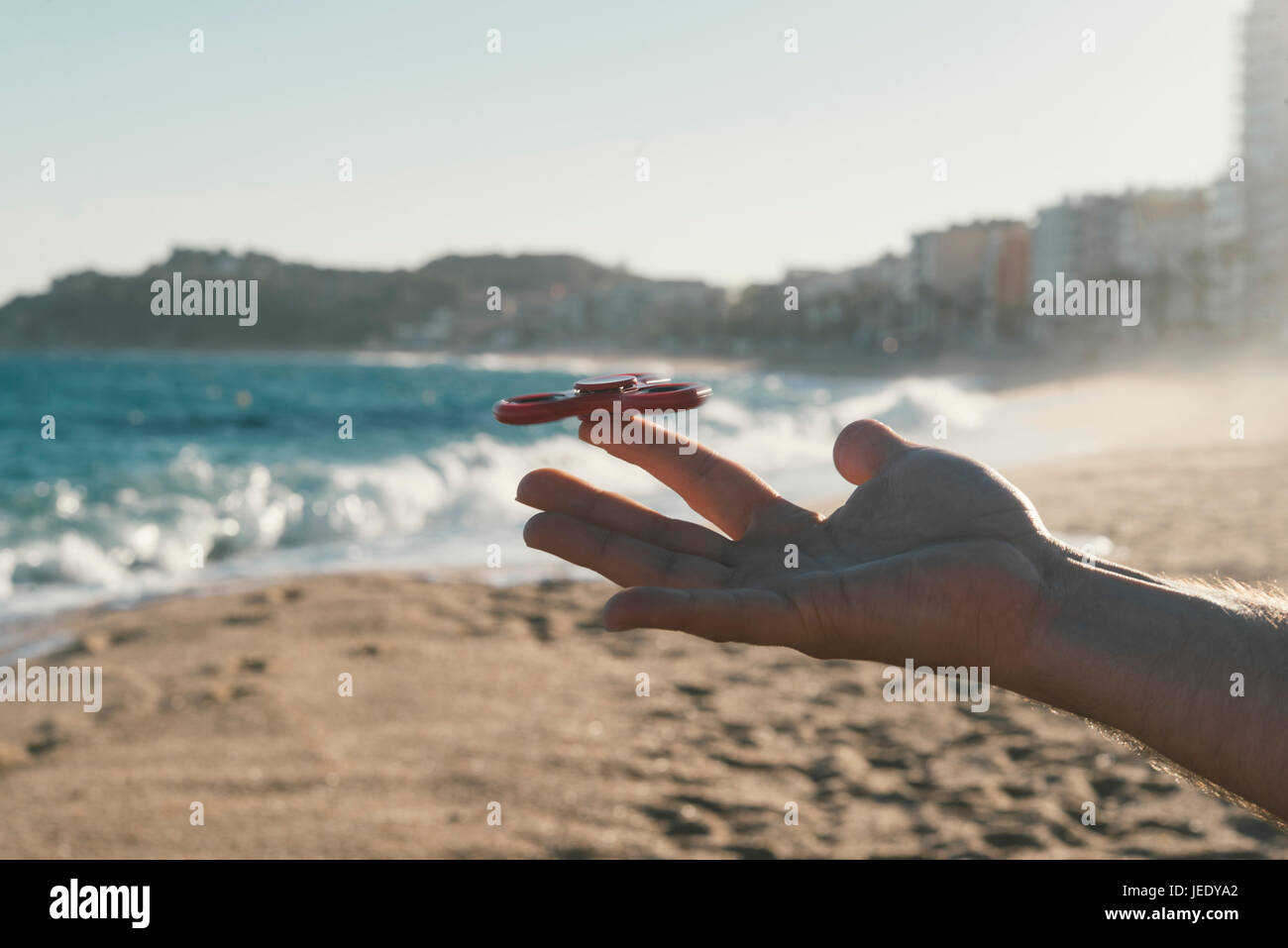 Man balancing Fidget spinner on his finger Stock Photo - Alamy