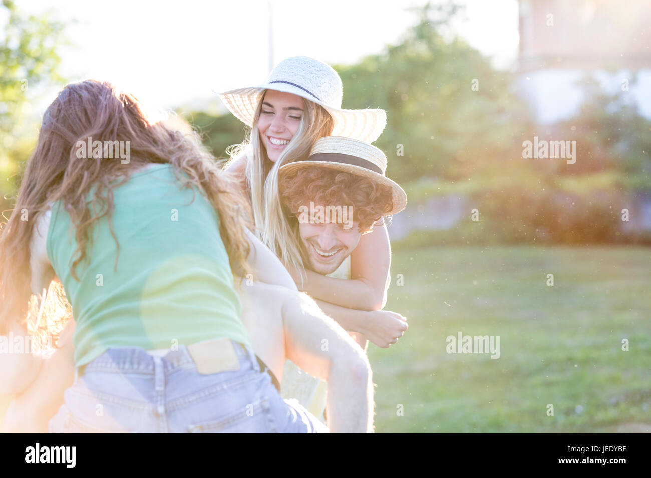 Friends having fun together in the garden Stock Photo - Alamy
