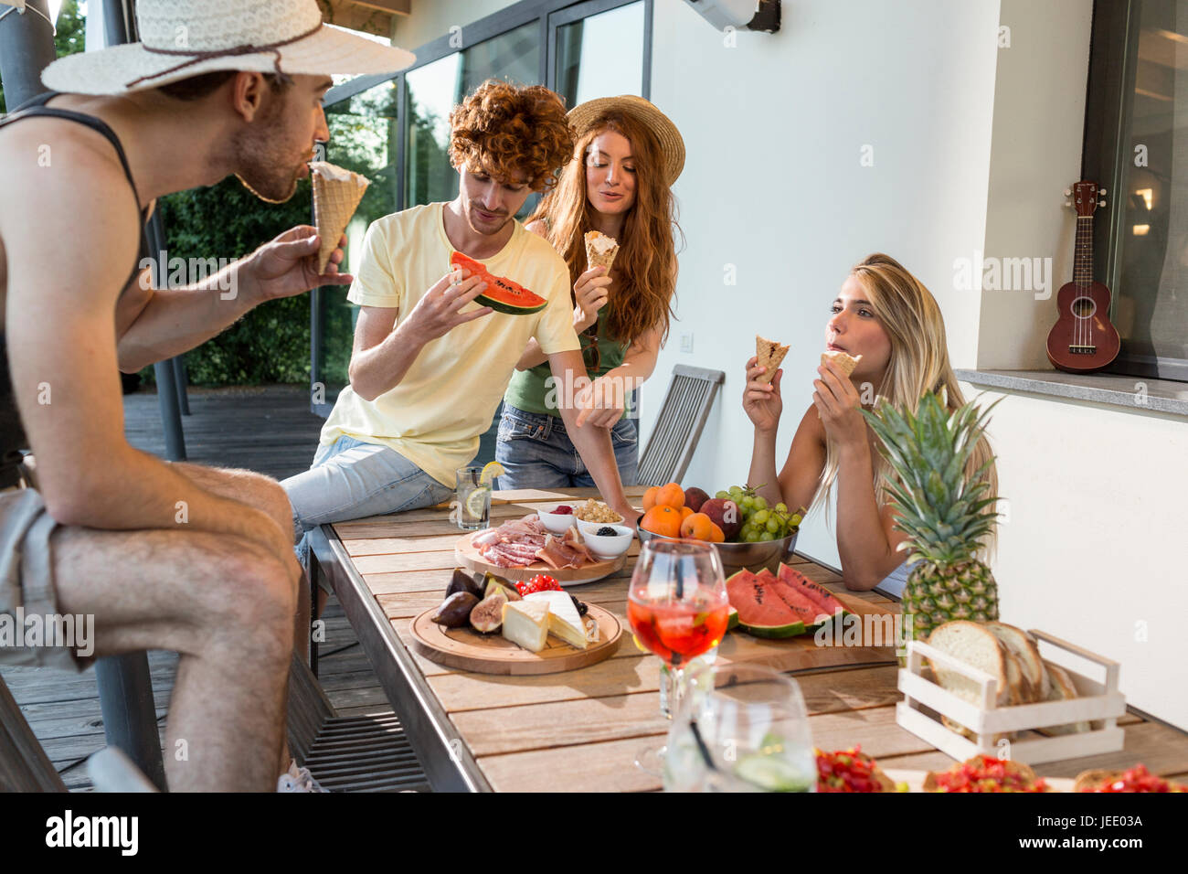 Woman eating afternoon snacks hi-res stock photography and images - Alamy