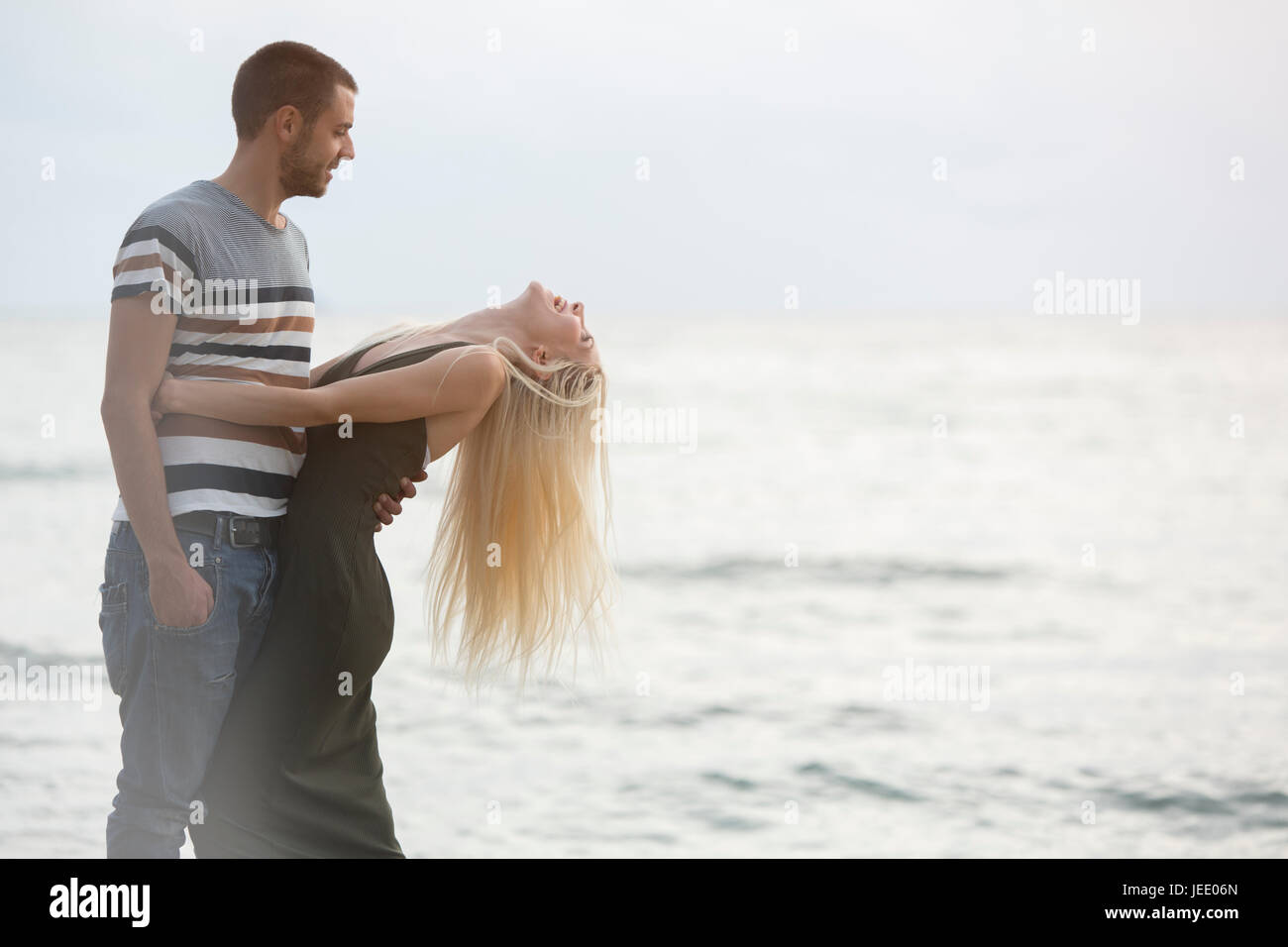 Happy couple by the sea Stock Photo - Alamy