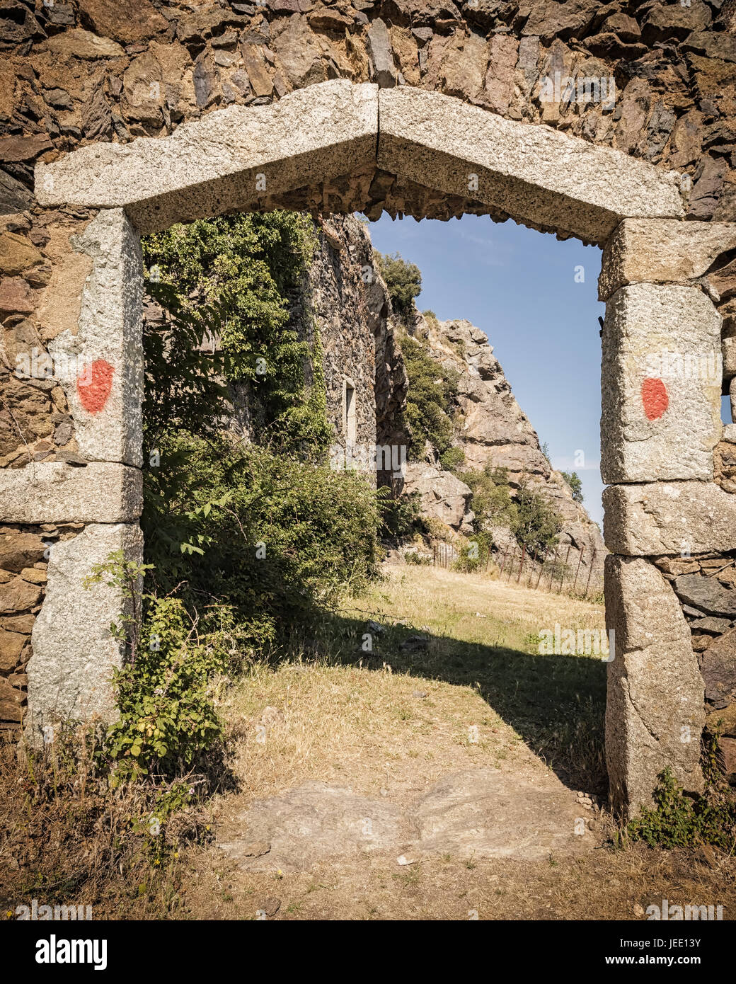 Stone entrance to "La maison du bandit", the bandit's house, above the ...