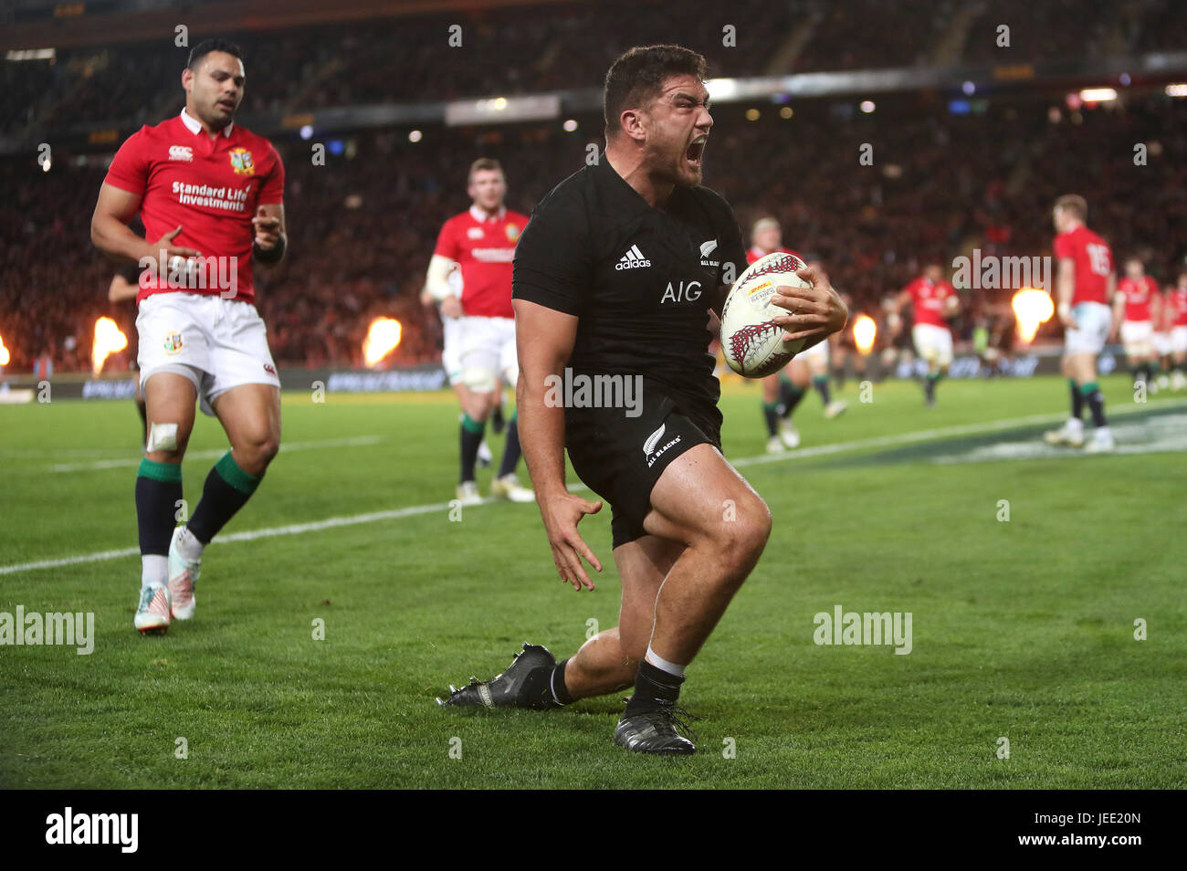 New Zealand's Codie Taylor celebrates scoring his side's first try ...