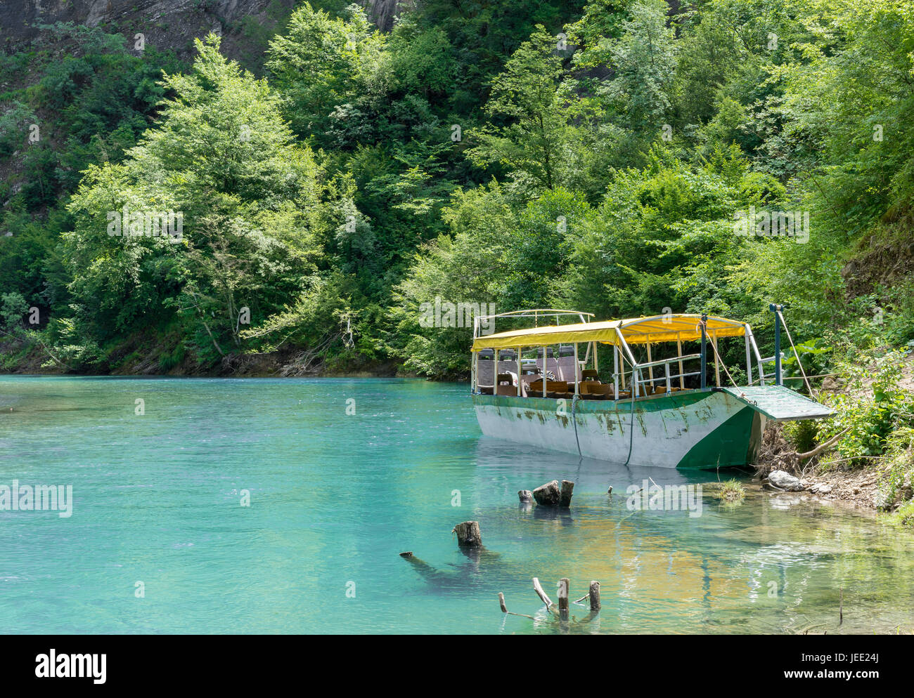 A unique boat on lake Koman Stock Photo - Alamy