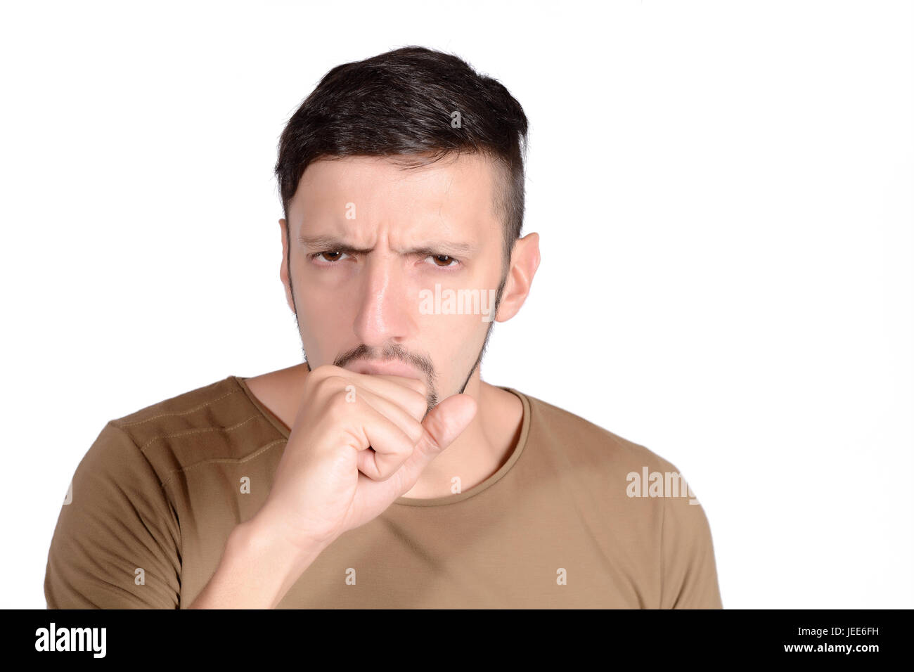 Portrait of a young man coughing. Isolated white background Stock Photo ...