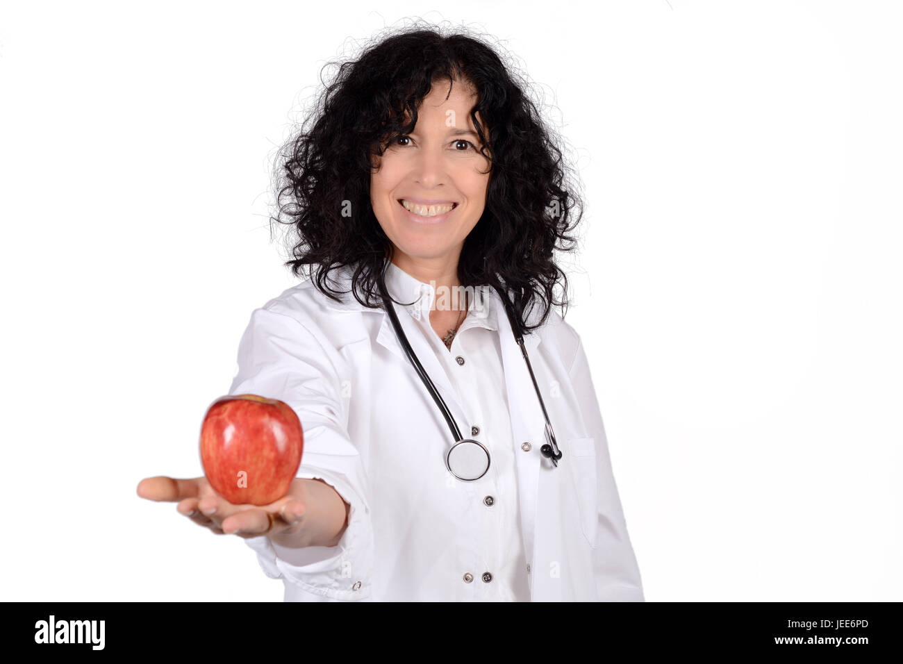 Portrait of beautiful female doctor with an apple. Healthy concept ...
