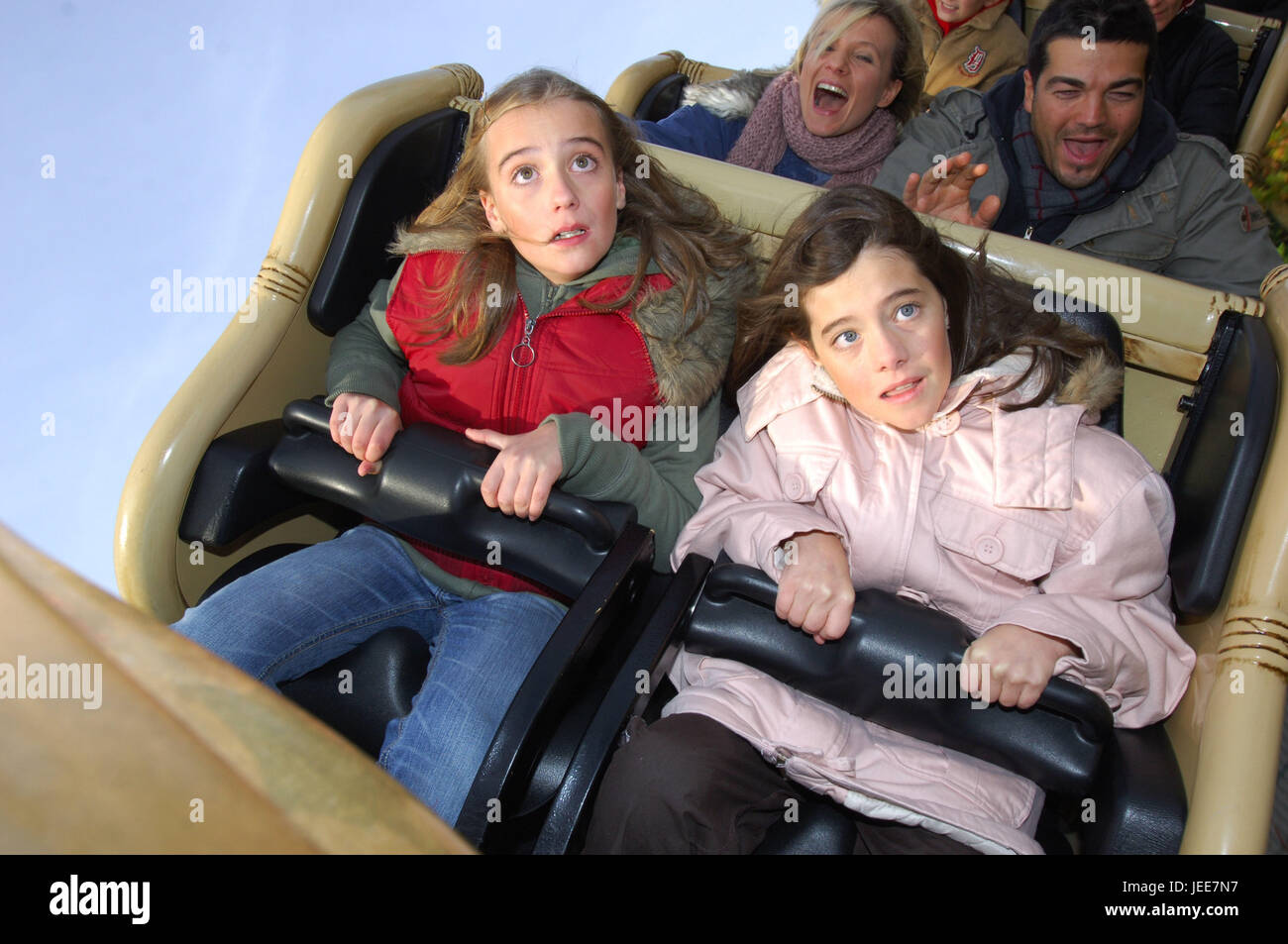 Parents, children, roller coaster Stock Photo - Alamy