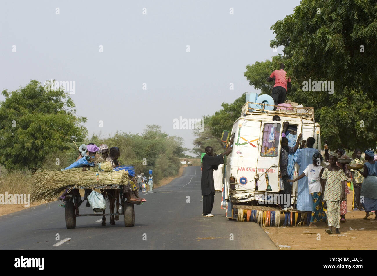 Ngaye Mekhe, street, bus, horse's carts, market, Senegal Stock Photo ...