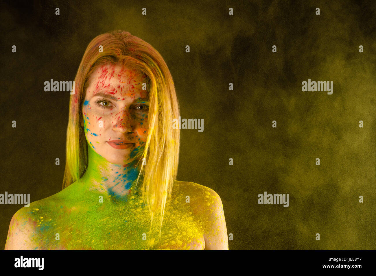 multicolor portrait blond woman in colors Holi Stock Photo - Alamy