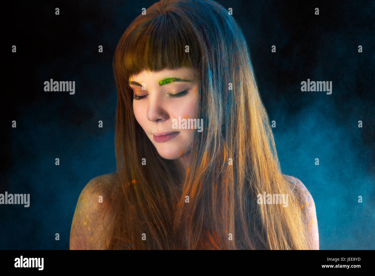 portrait beautiful long-haired girl in colors Holi Stock Photo - Alamy