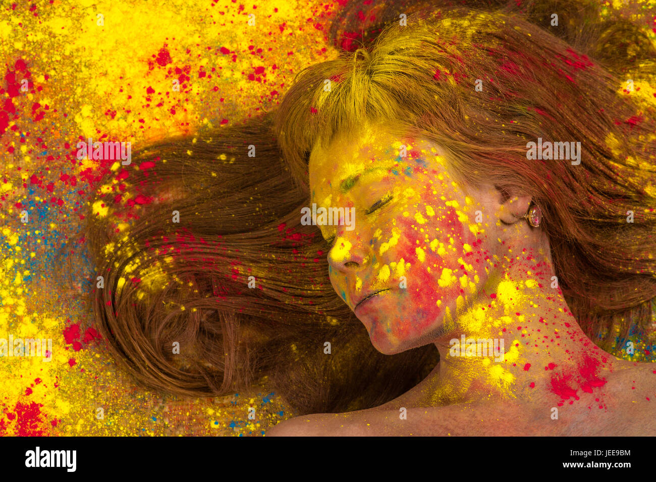 woman with yellow paint on face Stock Photo - Alamy