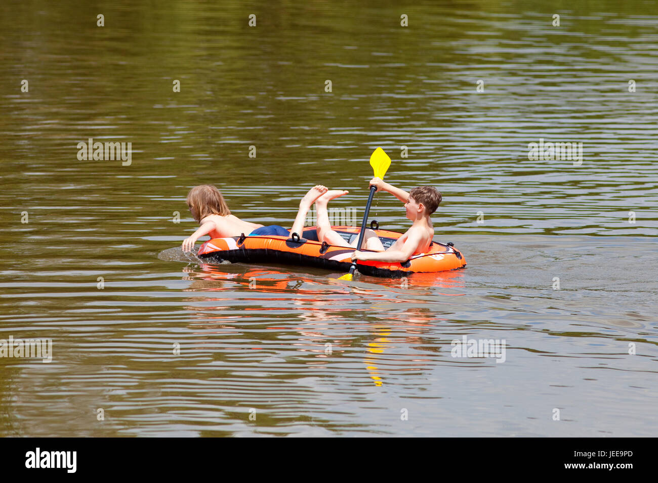 Two boys in inflatable boat hi-res stock photography and images - Alamy