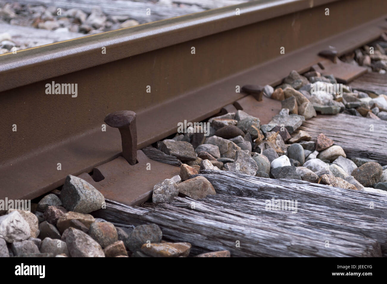 Nails in the tracks Stock Photo - Alamy